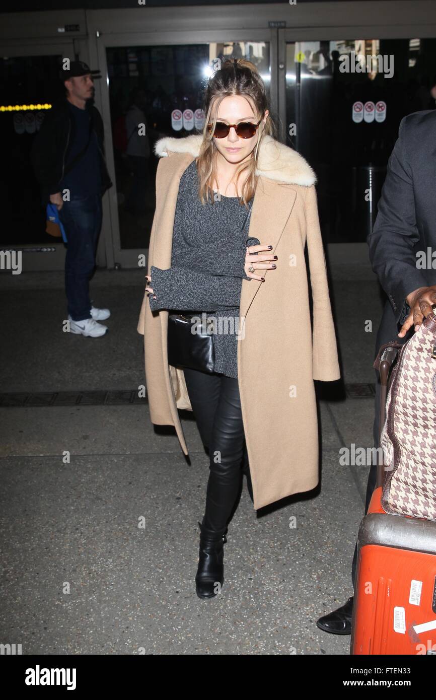 Elizabeth Olsen seen signing autographs as she arrives at LAX airport ...