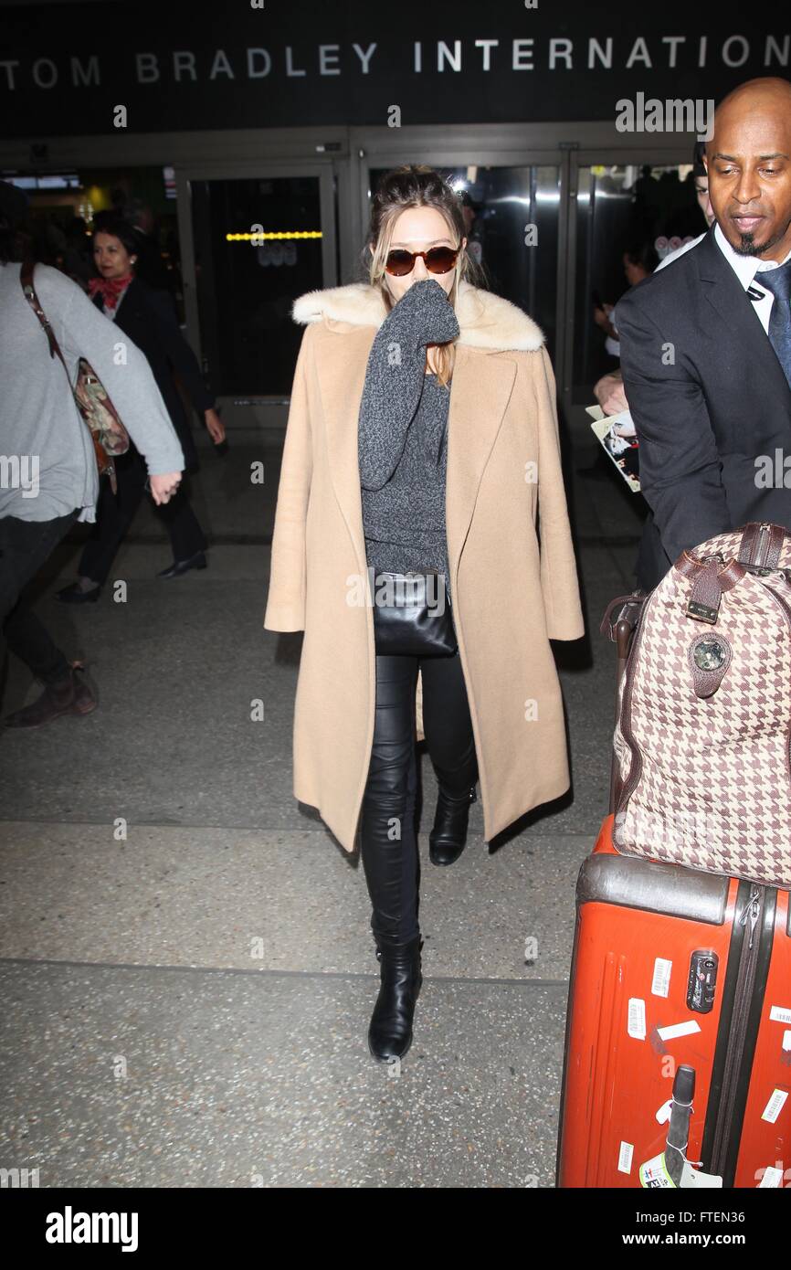 Elizabeth Olsen seen signing autographs as she arrives at LAX airport ...