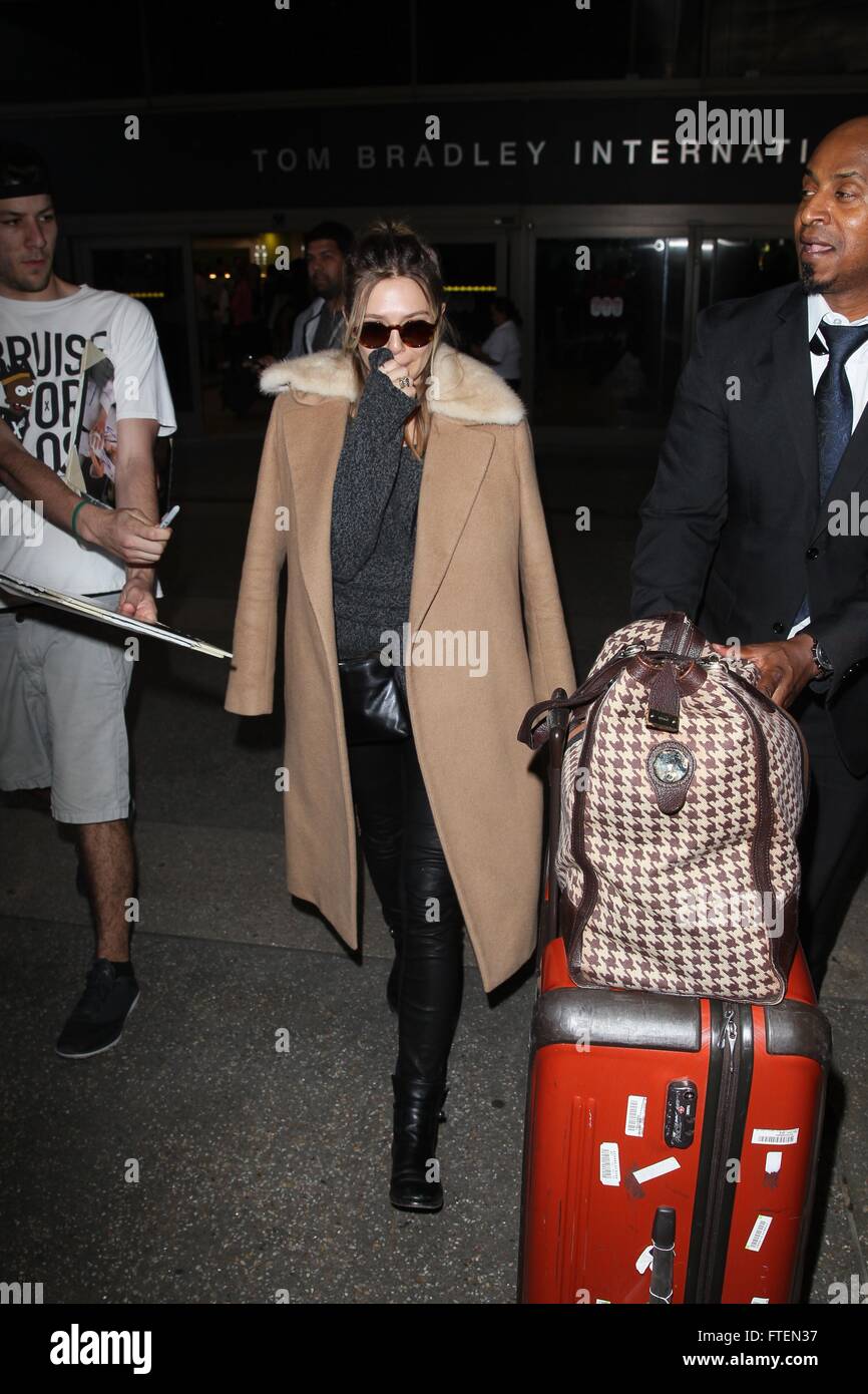 Elizabeth Olsen seen signing autographs as she arrives at LAX airport ...