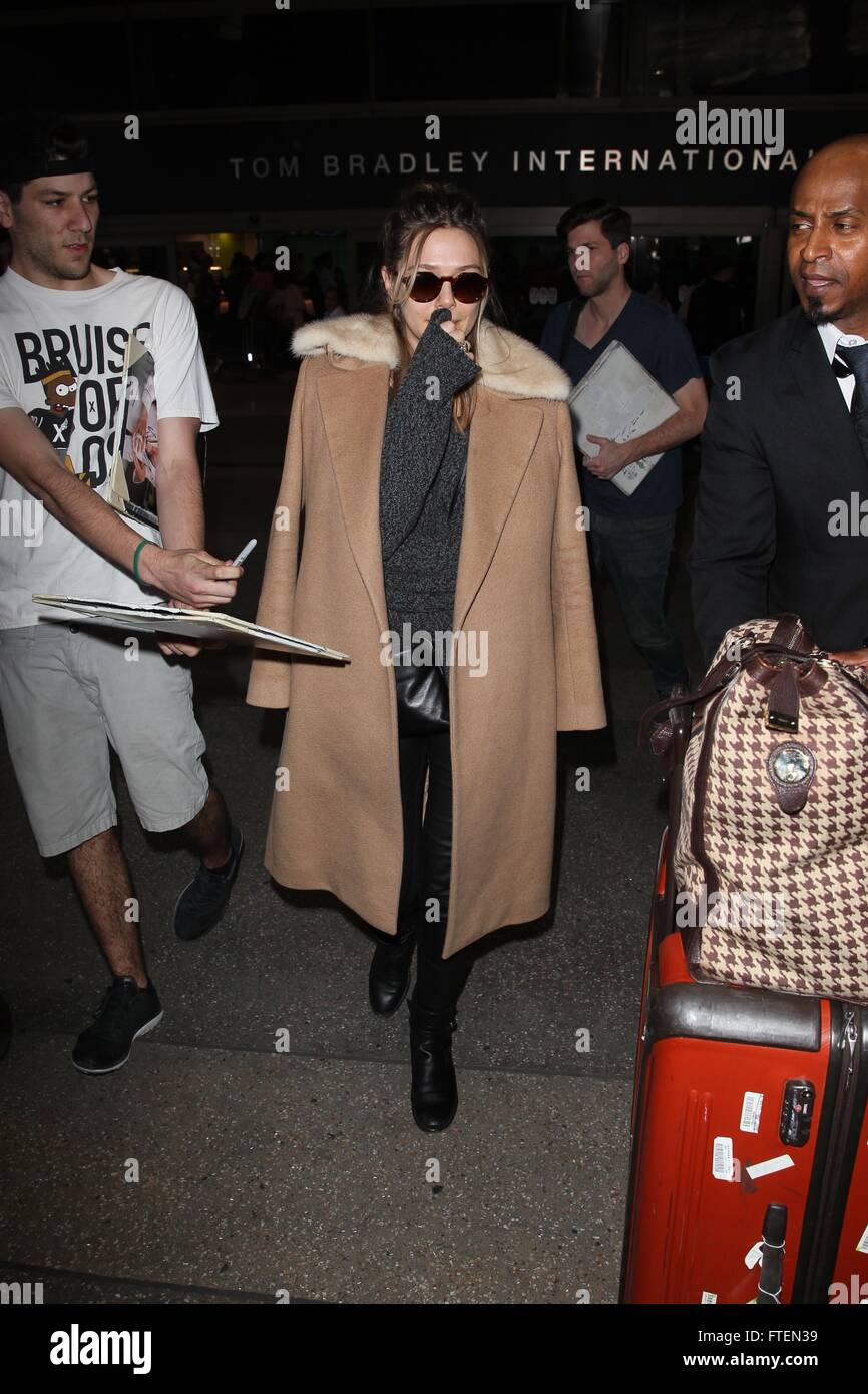 Elizabeth Olsen seen signing autographs as she arrives at LAX airport ...