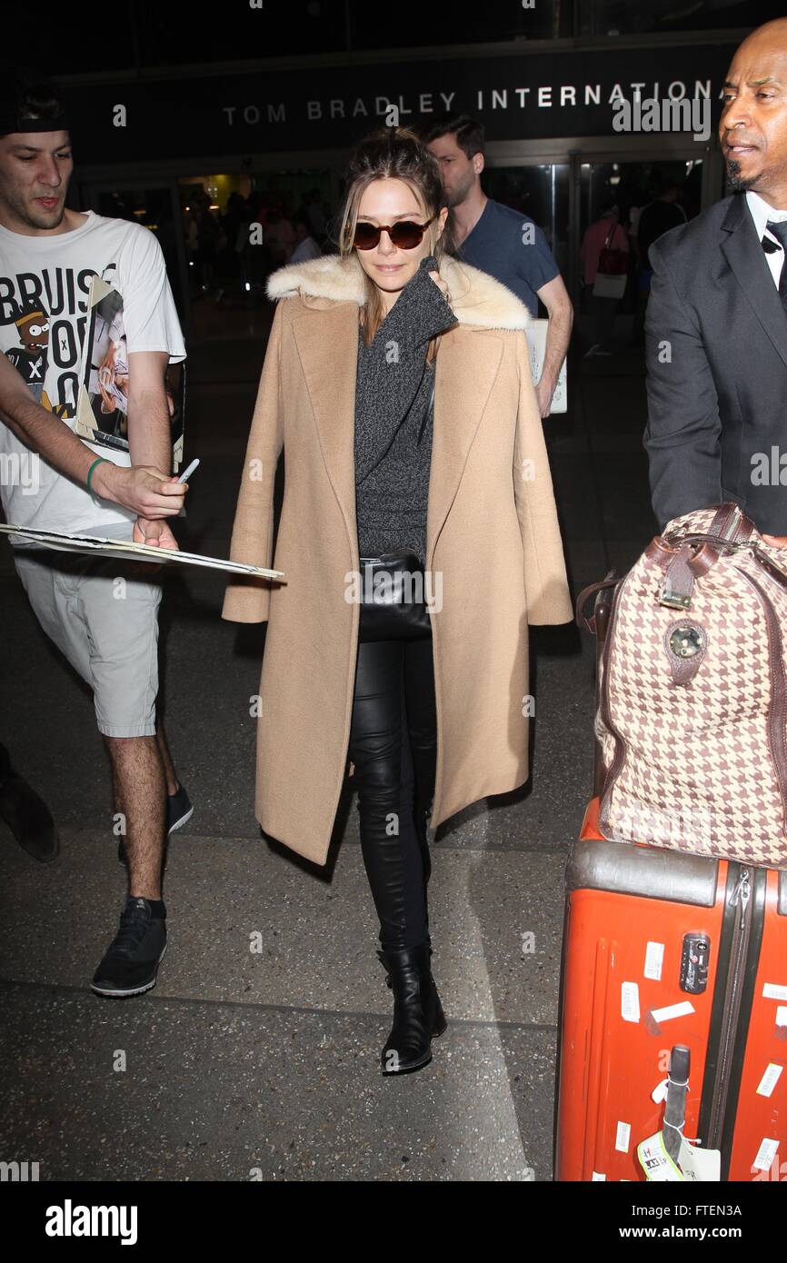 Elizabeth Olsen seen signing autographs as she arrives at LAX airport ...