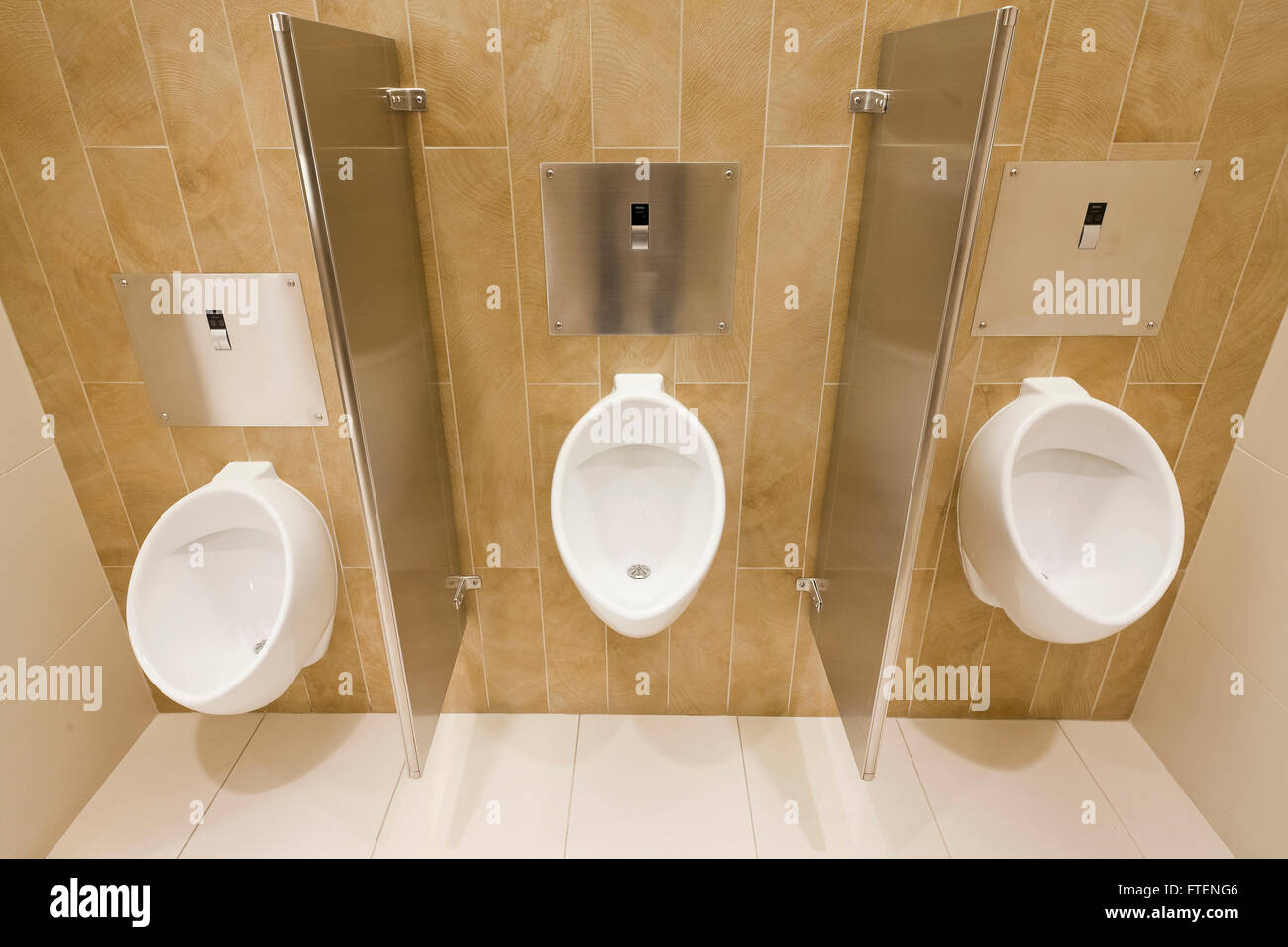 Public urinals in mens restroom - USA Stock Photo - Alamy