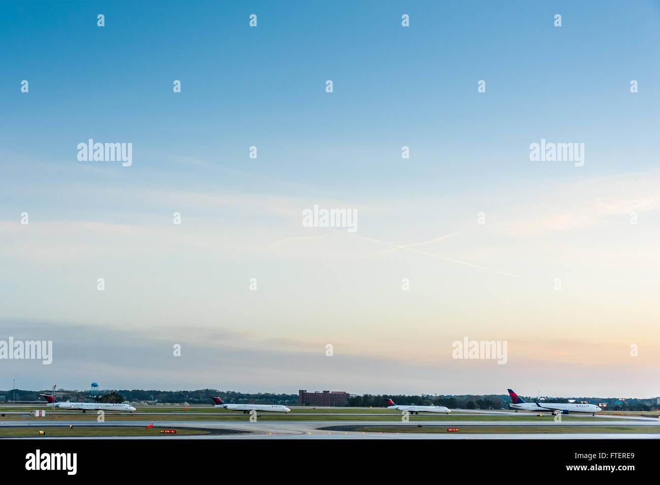 Four Delta Air Lines jets on a runway at Atlanta International Airport ...