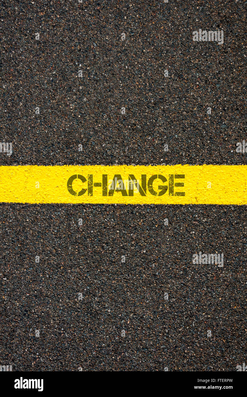Road marking yellow paint dividing line with word CHANGE, concept image ...