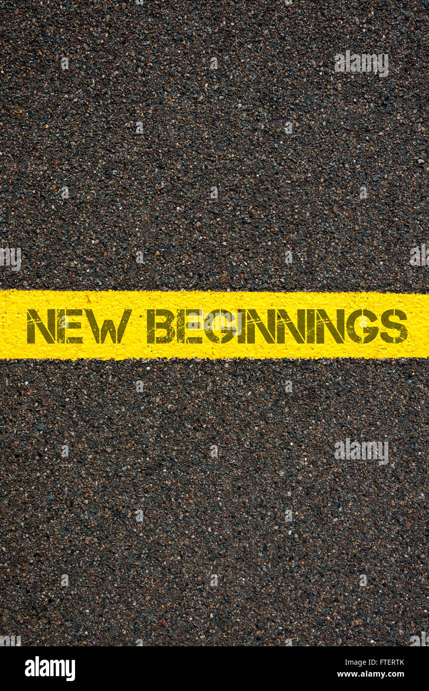Road marking yellow paint dividing line with words NEW BEGINNINGS ...