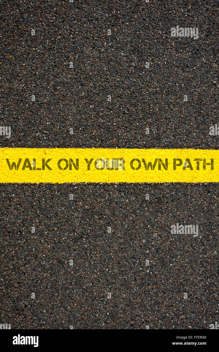 Road marking yellow paint dividing line with words WALK ON YOUR OWN ...