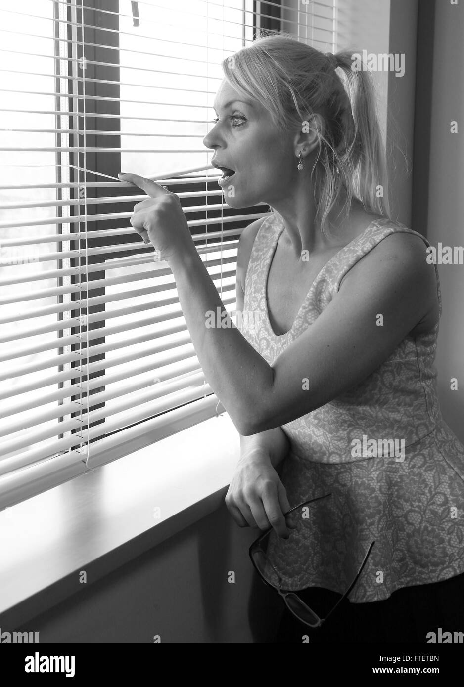 Beautiful blonde Eastern European mature woman looking expectantly out ...