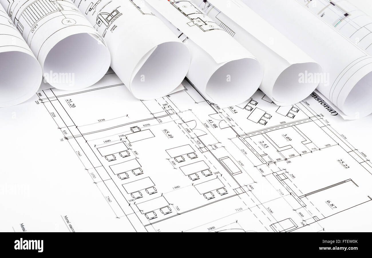 Architecture plan and rolls of blueprints Stock Photo - Alamy