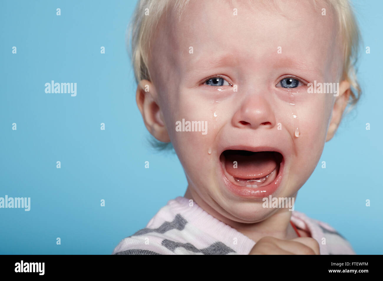 little cute child with tears on face Stock Photo - Alamy