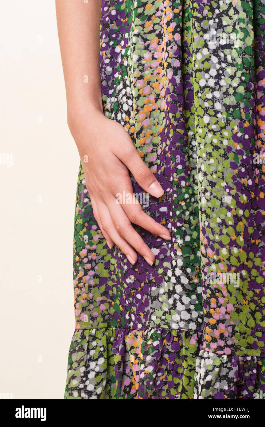 Close up of a young woman's hand wearing a long dress Stock Photo - Alamy
