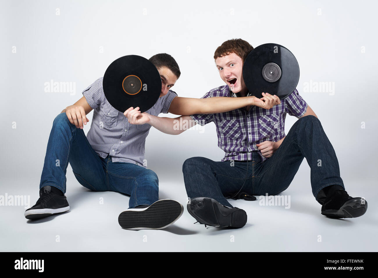 two crazy guys with plates Stock Photo - Alamy