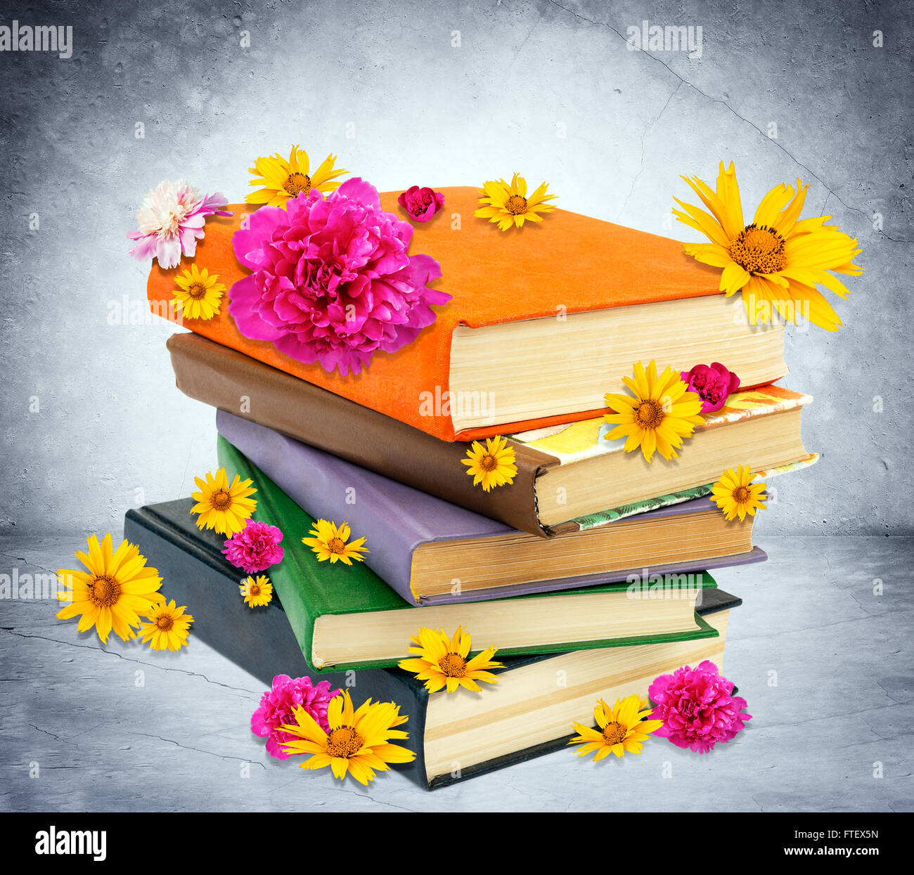 Pile of books with flowers Stock Photo - Alamy