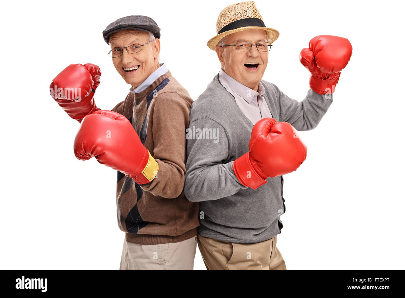 Two senior gentlemen posing together with boxing gloves isolated on ...
