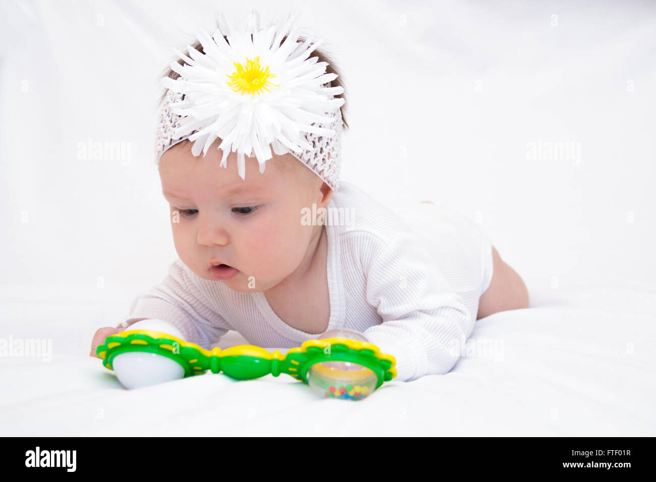 Baby playing with rattle hi-res stock photography and images - Alamy