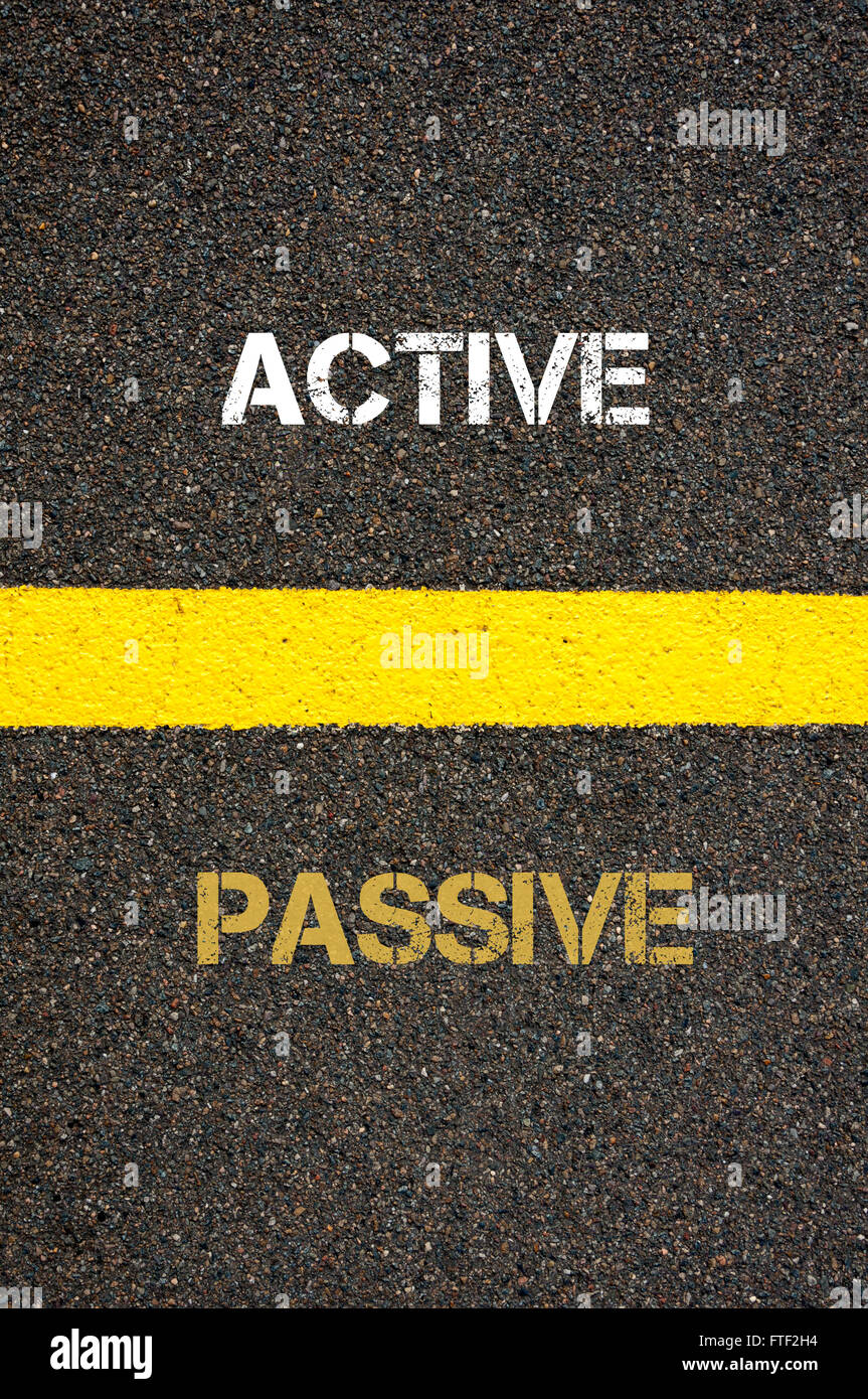 Antonym decision concept of PASSIVE versus ACTIVE written over tarmac ...