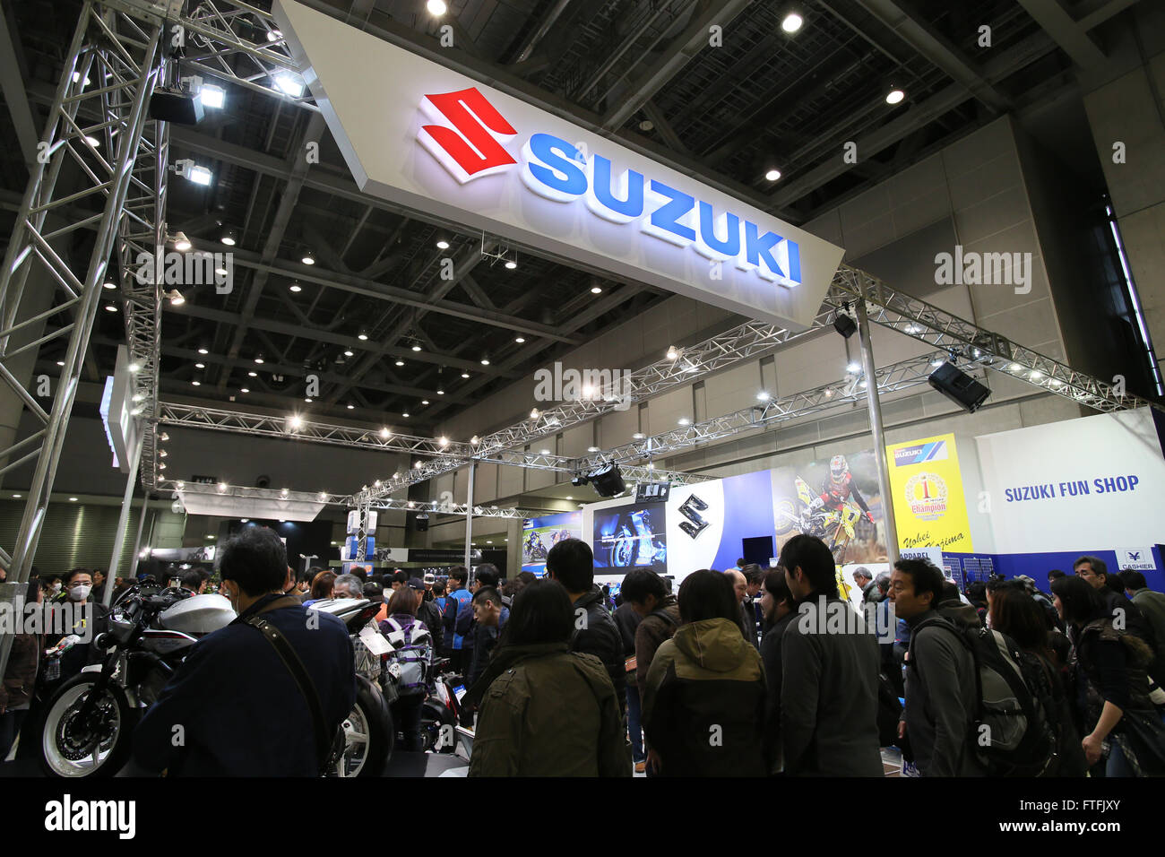 Tokyo, Japan. 27th Mar, 2016. Motorcycle fans gather at the booth of ...