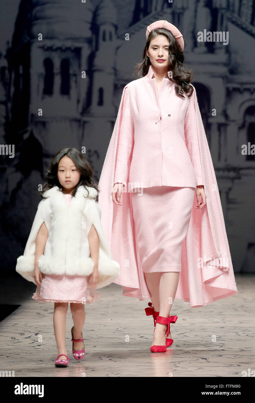 Beijing, China. 28th Mar, 2016. Models present creations by designer Xu ...