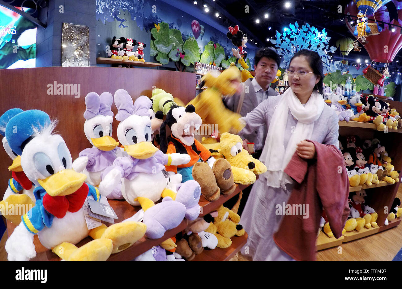 Shanghai. 28th Mar, 2016. Customers select toys at the Disney's ...