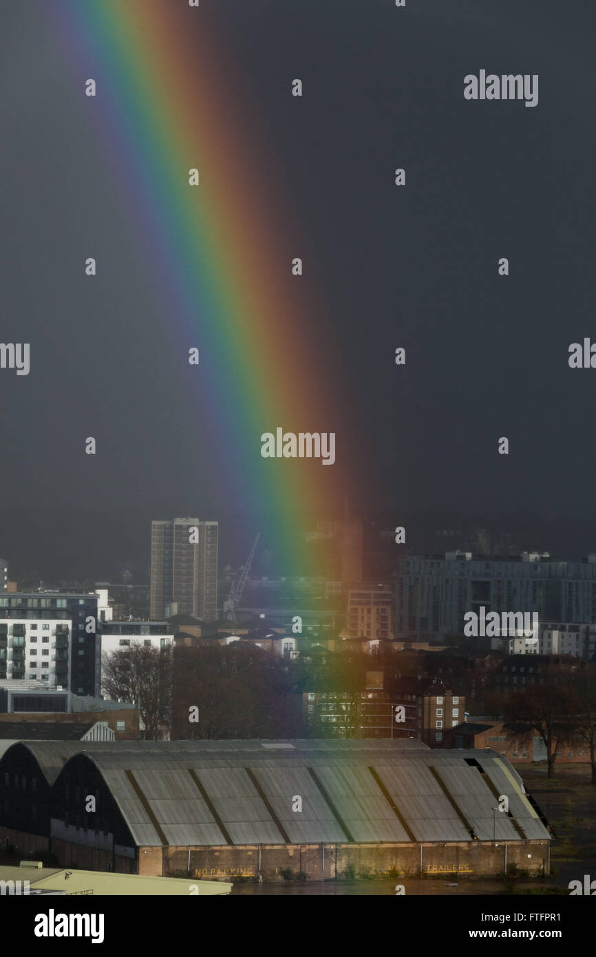 London, UK. 28th March, 2016. UK Weather: Colourful rainbow breaks ...