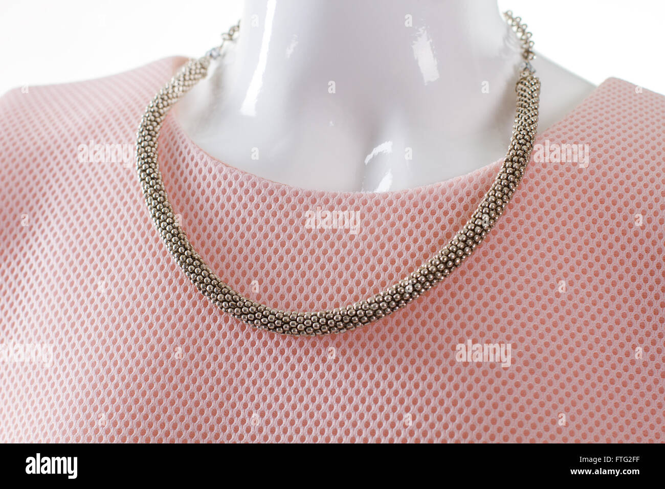 Delicate metal necklace on mannequin. Female mannequin with precious ...