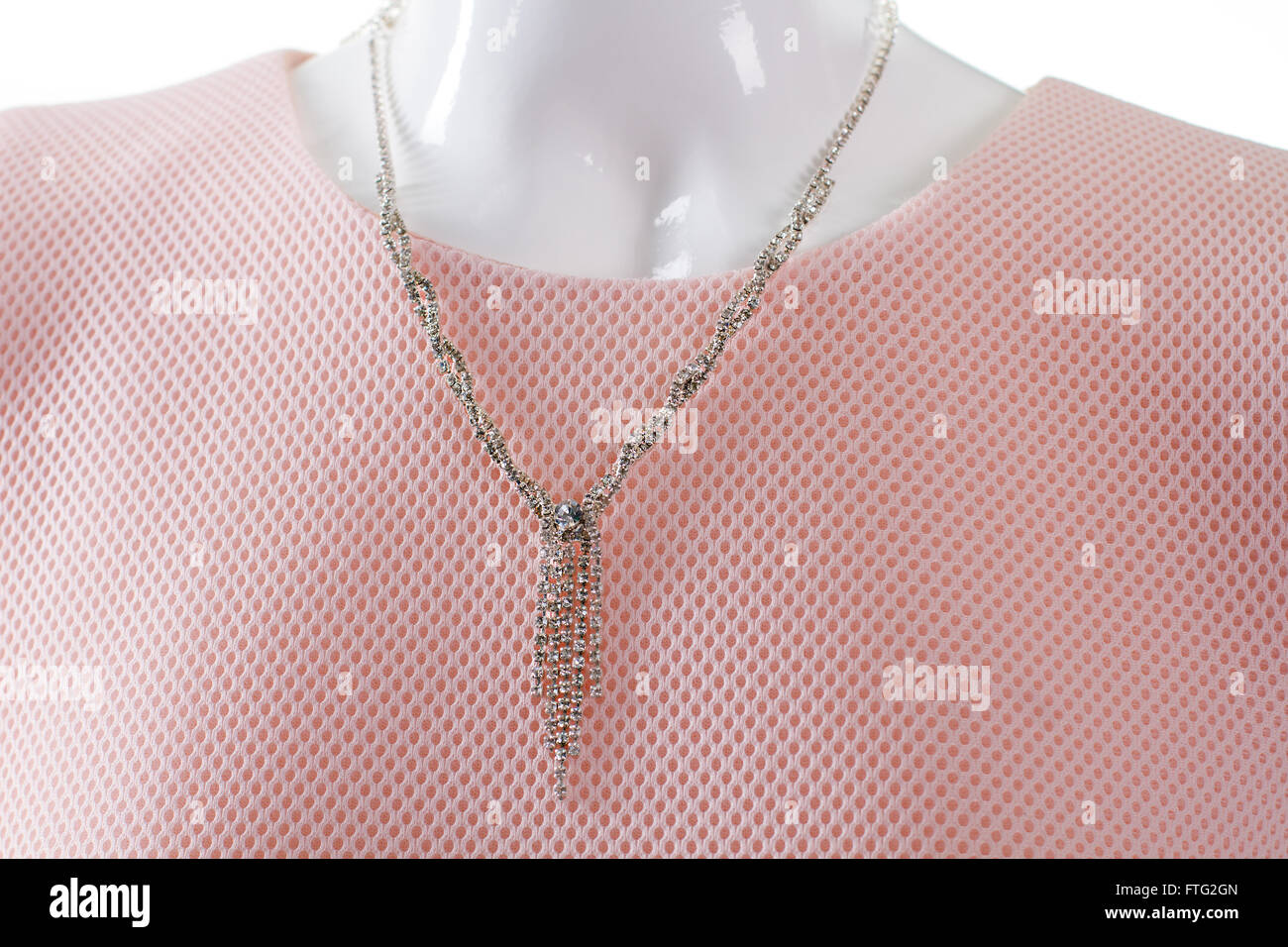 Expensive jewelry on mannequin's neck. Female mannequin with charming ...