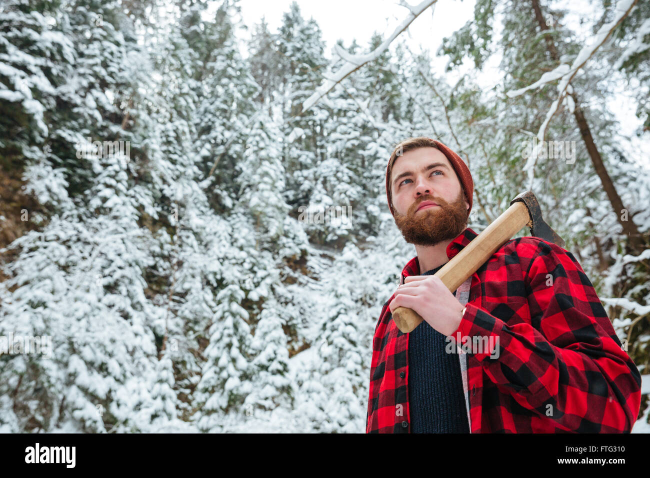 Man walking into forest with axe hi-res stock photography and images ...
