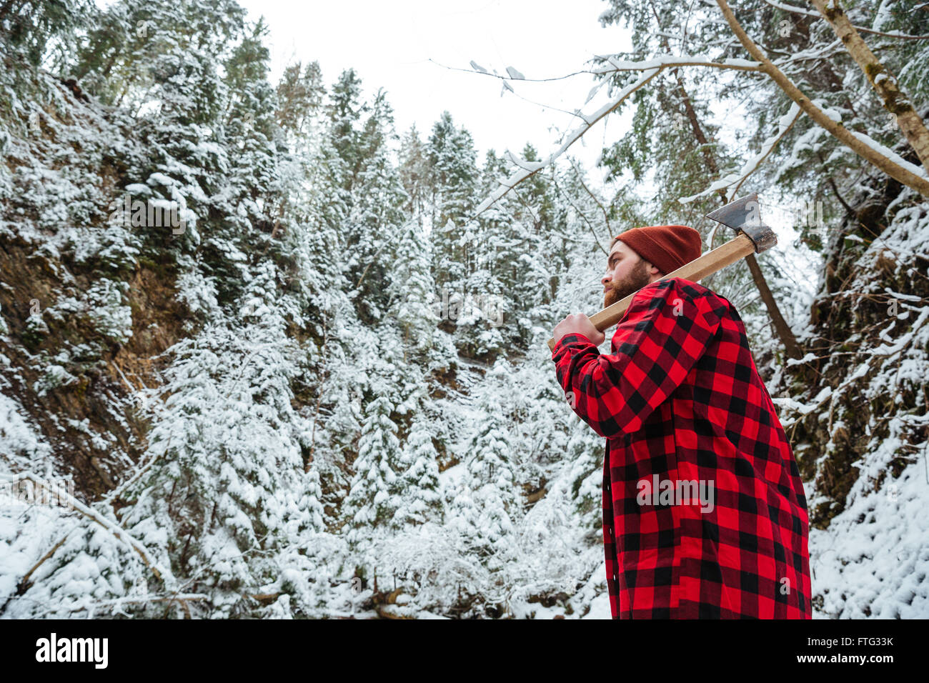 Man walking into forest with axe hi-res stock photography and images ...