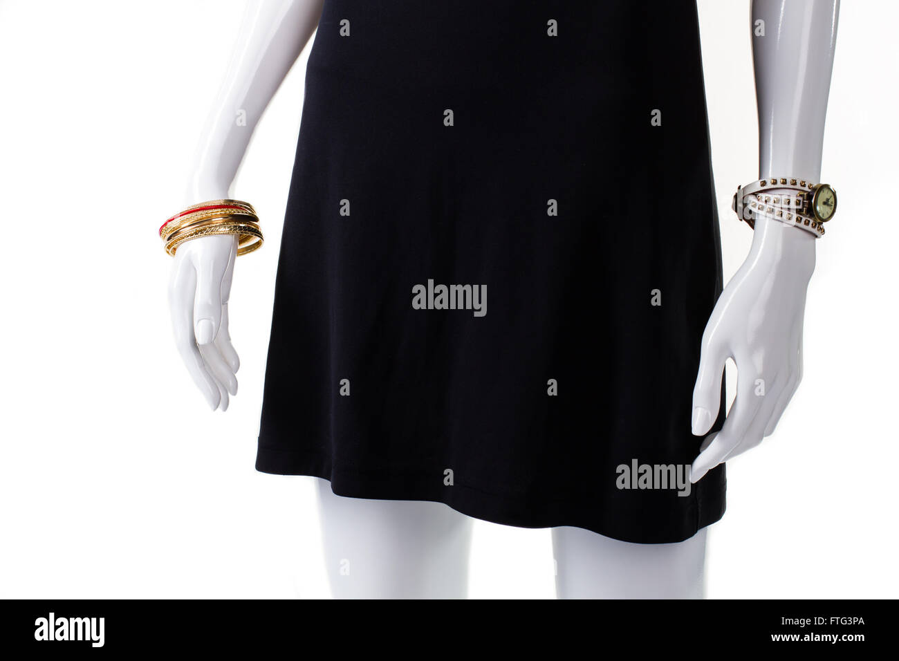 Golden bracelet and black dress Stock Photo - Alamy