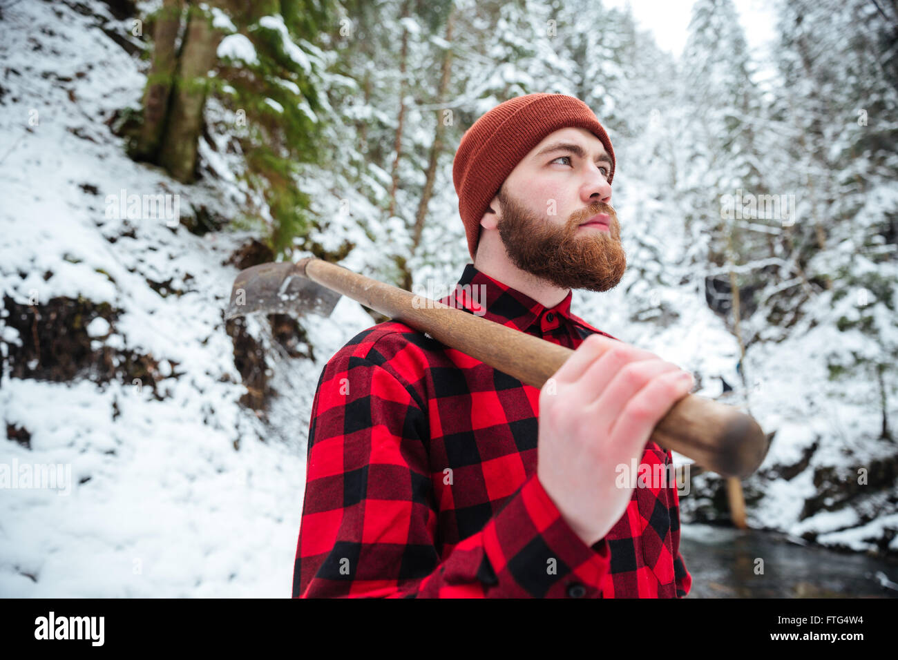 Man holding shovel outdoors with snow on background Stock Photo - Alamy