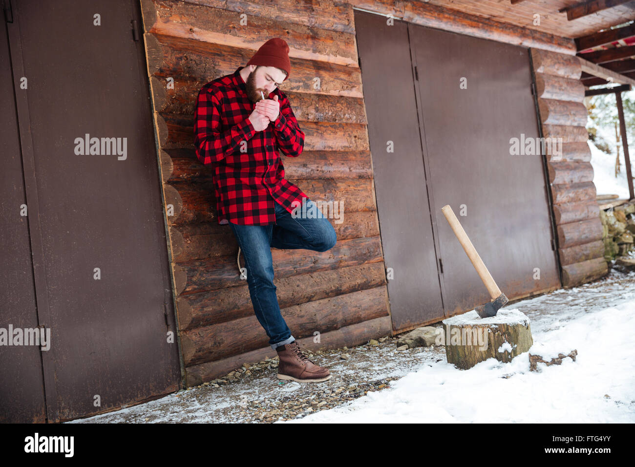 Full length portrait of a man smoking outdoors Stock Photo - Alamy