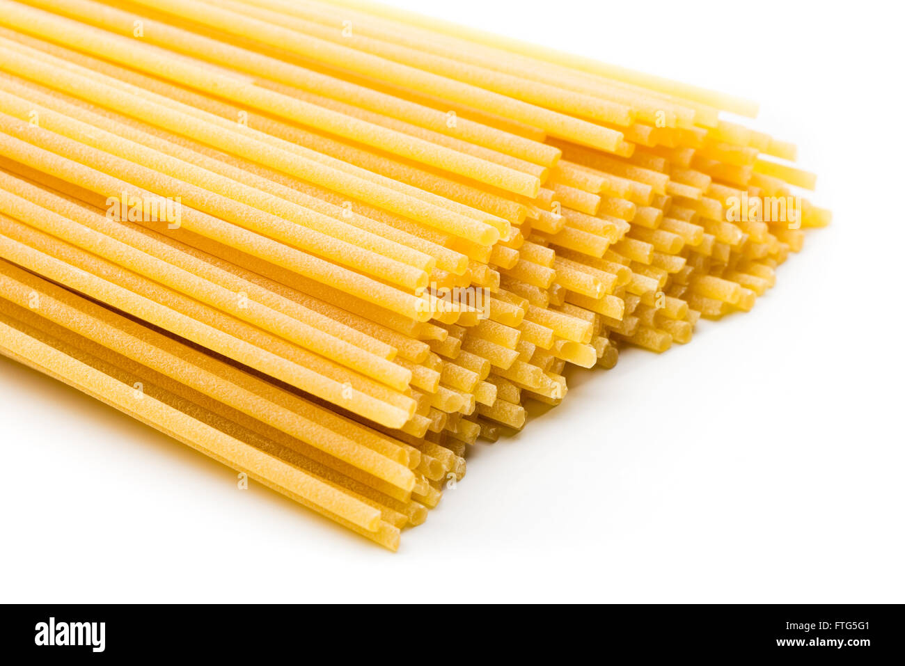 Italian spaghetti extruded through bronze, on white background Stock ...