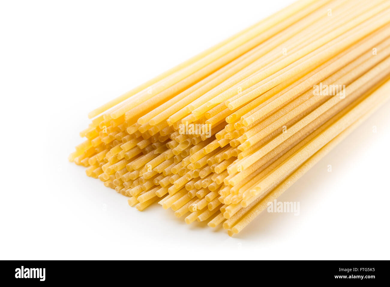 Italian spaghetti extruded through bronze, on white background Stock ...