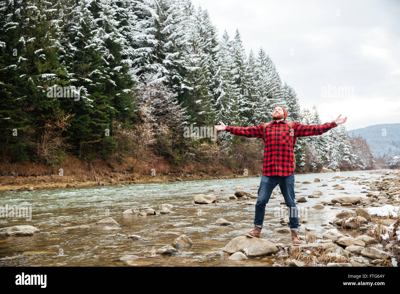 Happy male hiker having fun on the river Stock Photo - Alamy
