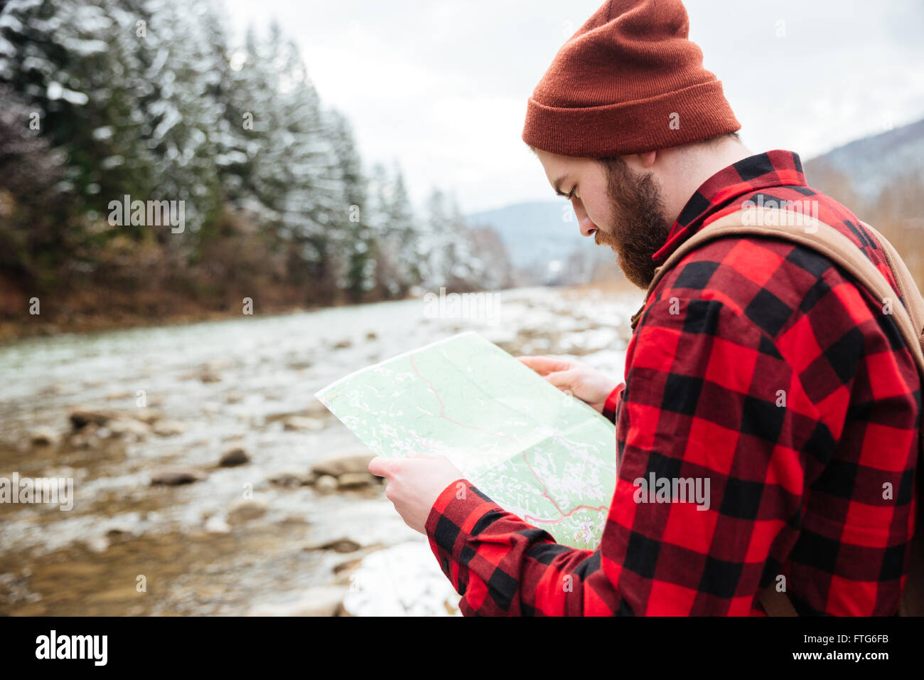Male hiker reading map outdoors Stock Photo - Alamy