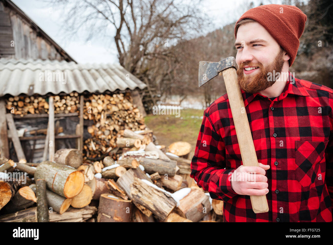 Smiling man holding axe hi-res stock photography and images - Alamy