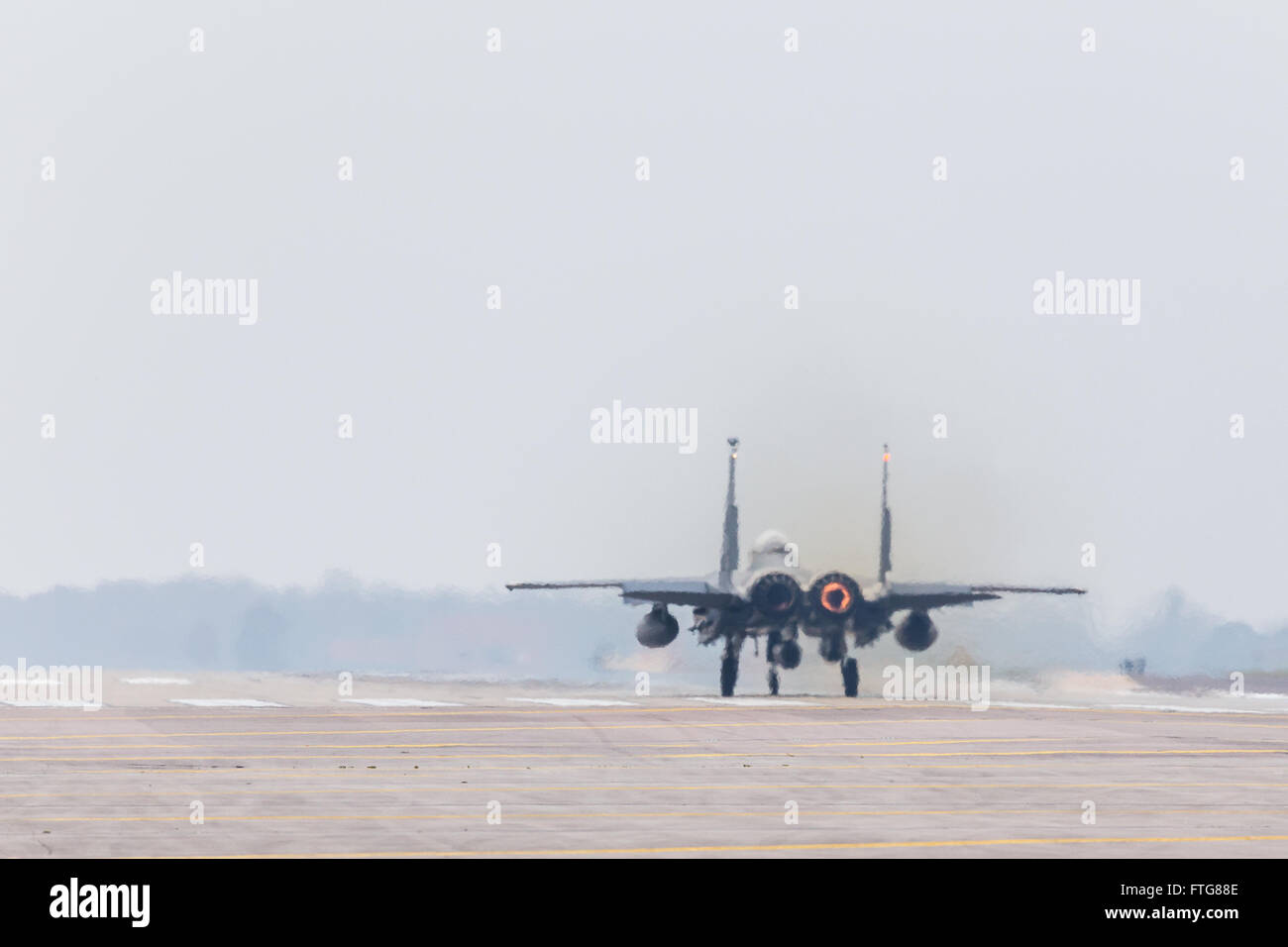 A Strike Eagle lighting up as it leaves the runway at RAF Lakenheath ...