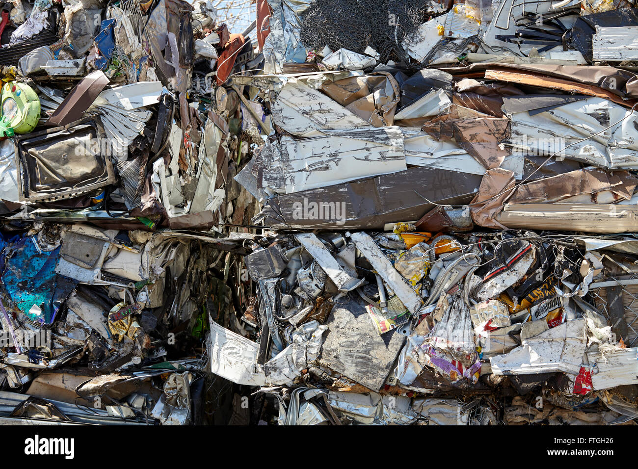Scrap metal refuse compacted for recycling Stock Photo - Alamy