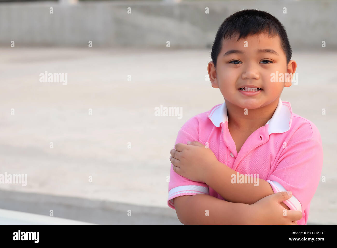 Kid portrait smiling and cross one's arm - Asia children Stock Photo ...