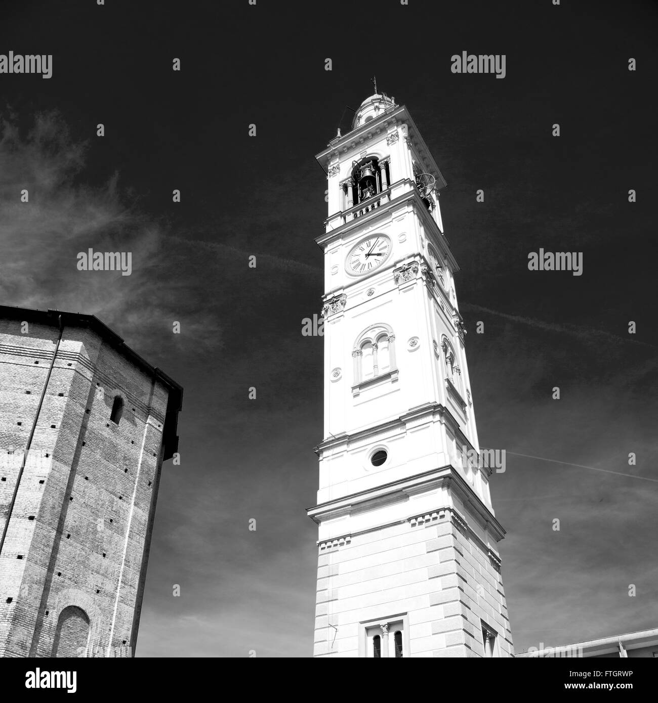 ancien clock tower in italy europe old stone and bell Stock Photo - Alamy
