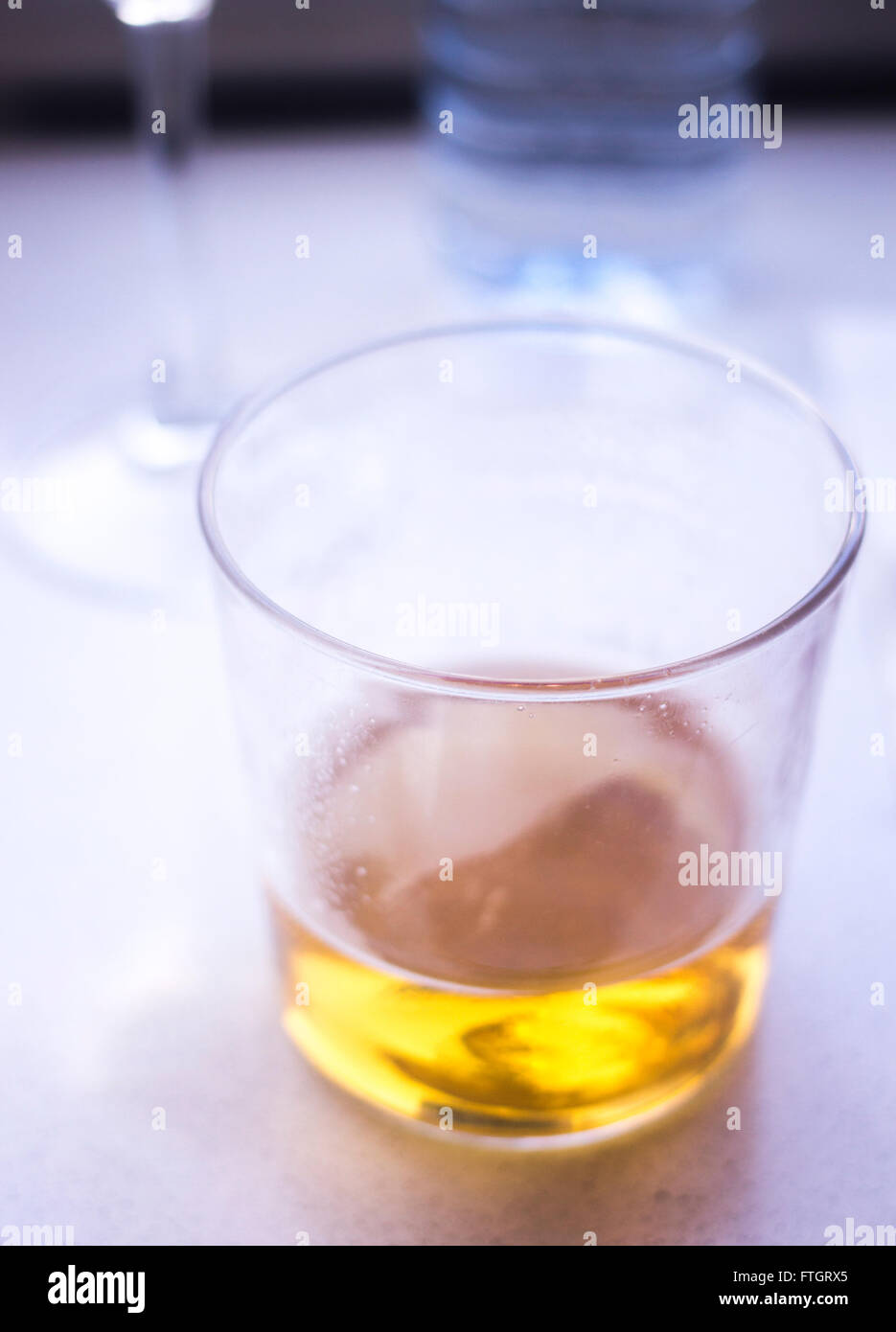 Half empty lager beer glass in restaurant bar photo Stock Photo - Alamy