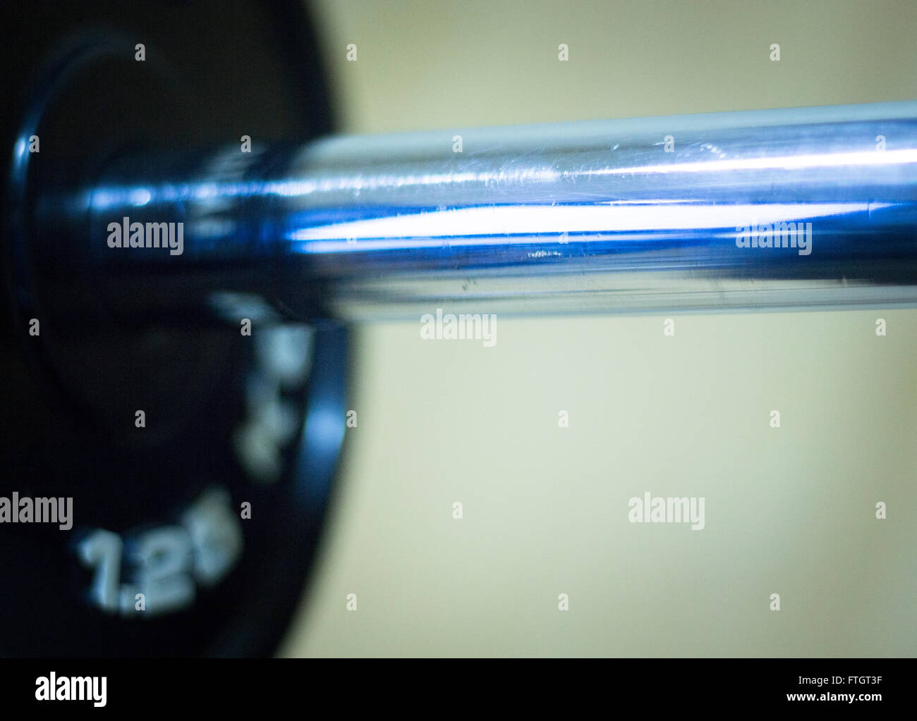 Chromed metal dumbell in crossfit, bodybuilding and weight training ...