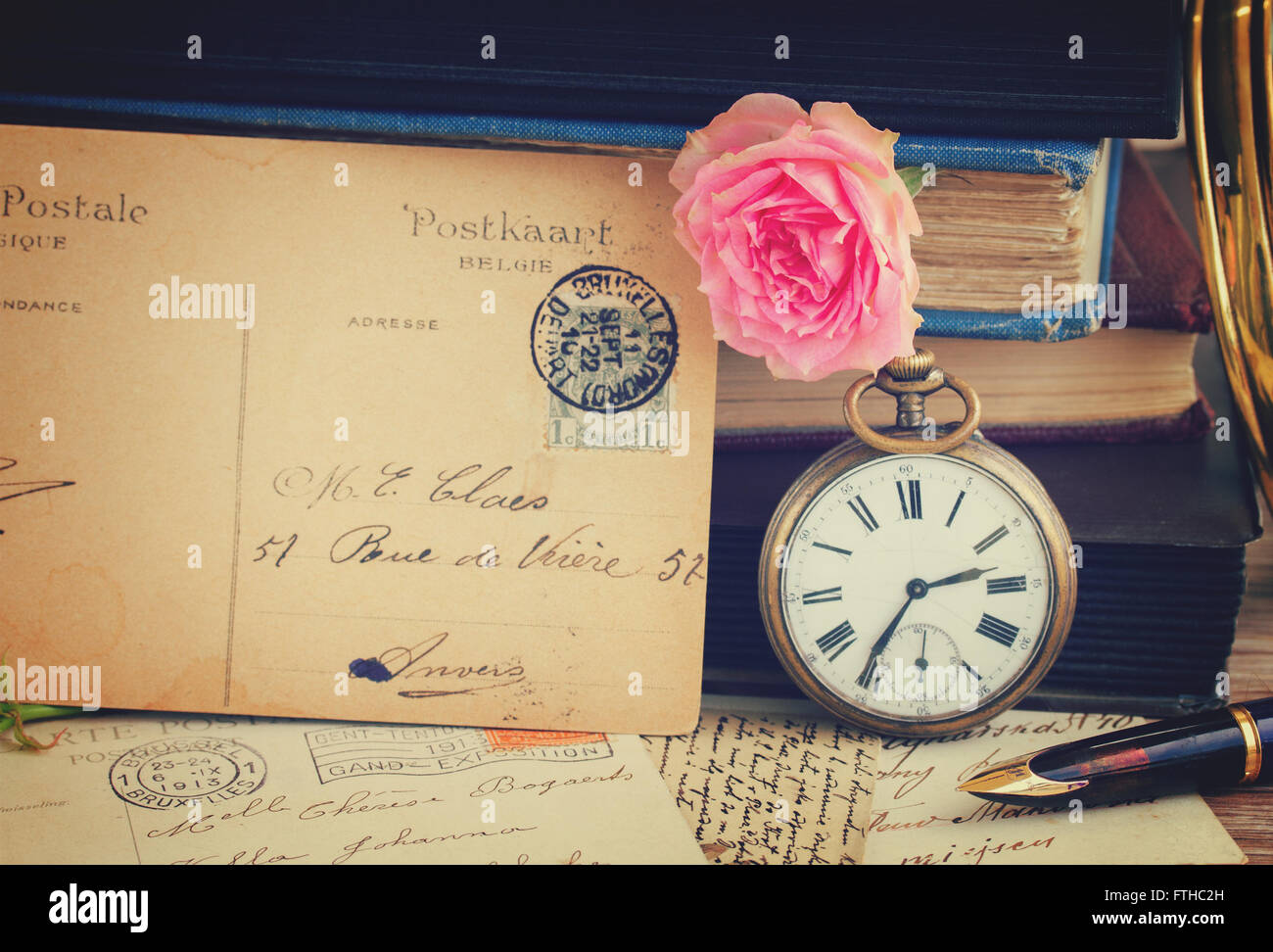 antique clock on old books and letters background Stock Photo - Alamy