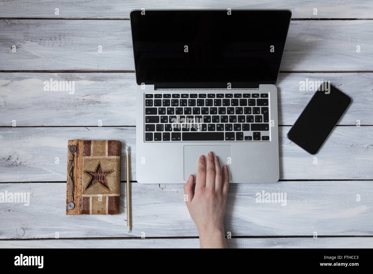 Notebook on top laptop hi-res stock photography and images - Alamy