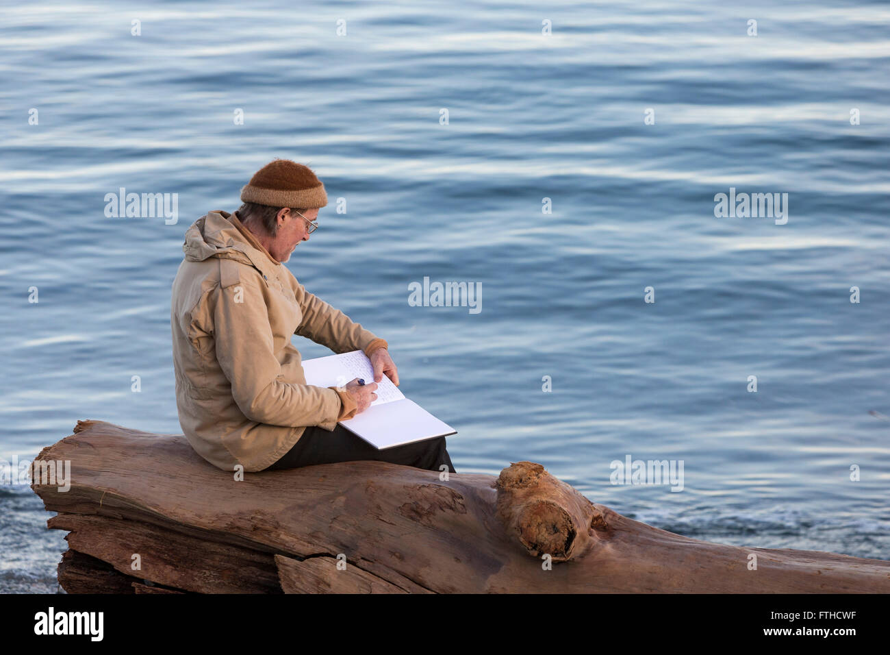 Man notebook writing hi-res stock photography and images - Alamy