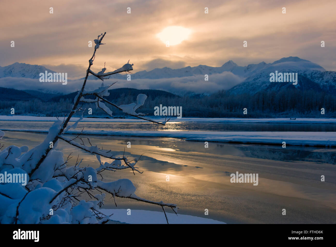 Landscape of river and mountain covered with snow, Haines, Alaska, USA ...
