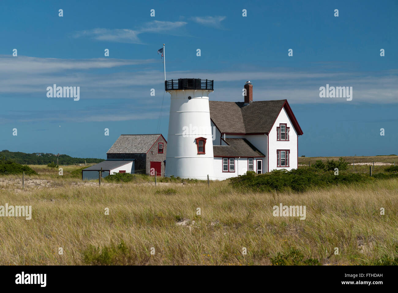 Stage Harbor lighthouse is a famous beacon on Cape Cod with its lantern ...