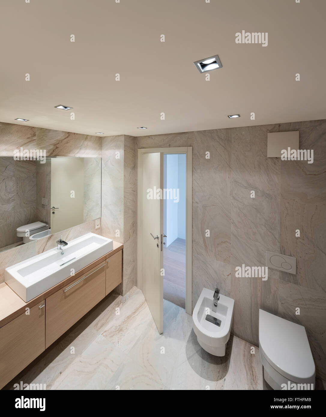 New house, inside the marble bathroom with sink modern design Stock ...