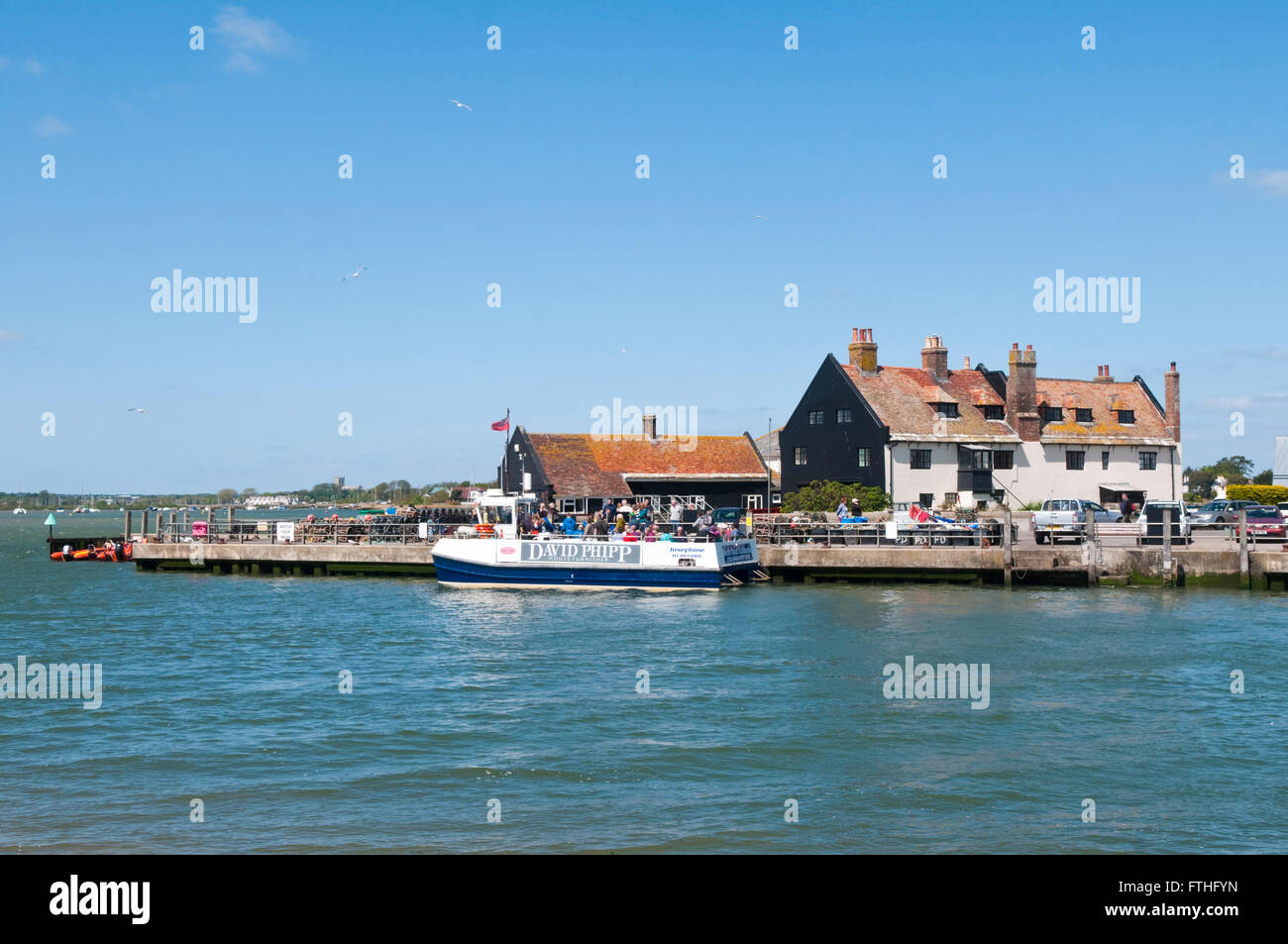 Mudeford Quay near Christchurch in Dorset with the ferry which takes ...