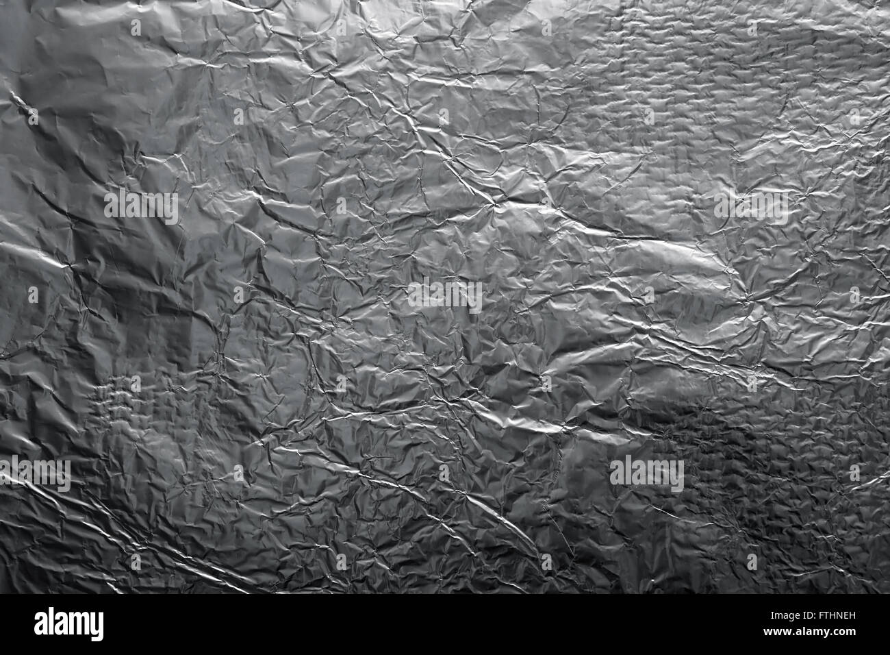 The texture of shiny aluminum foil close up Stock Photo - Alamy