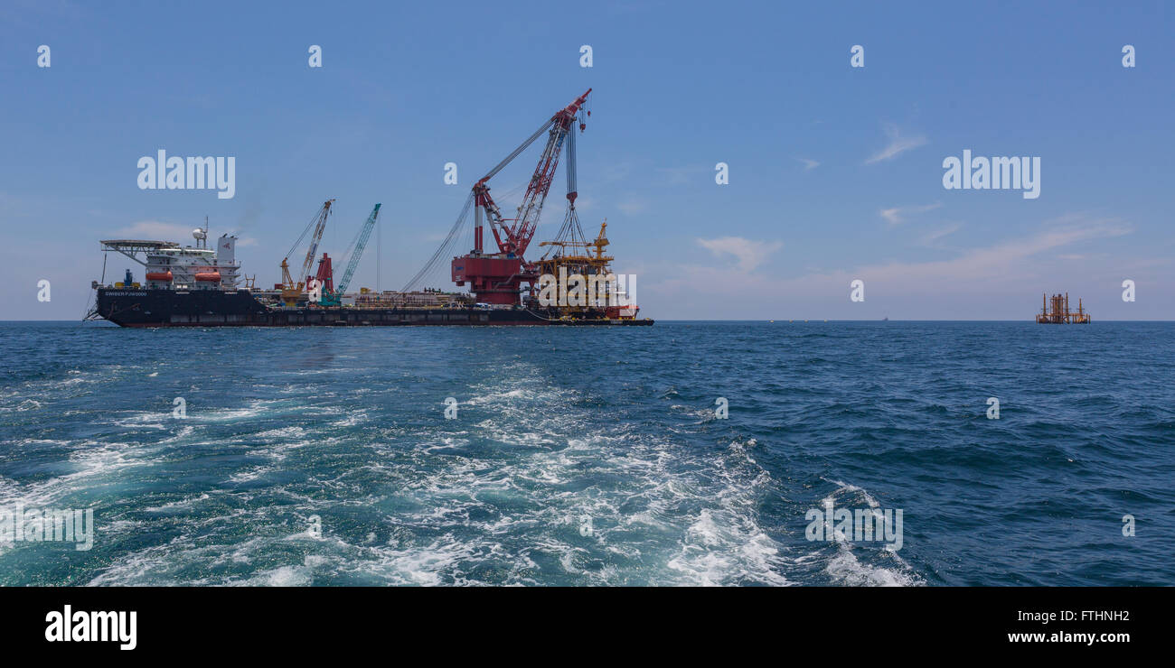 Oil rig lifting for installation on its jacket Stock Photo - Alamy